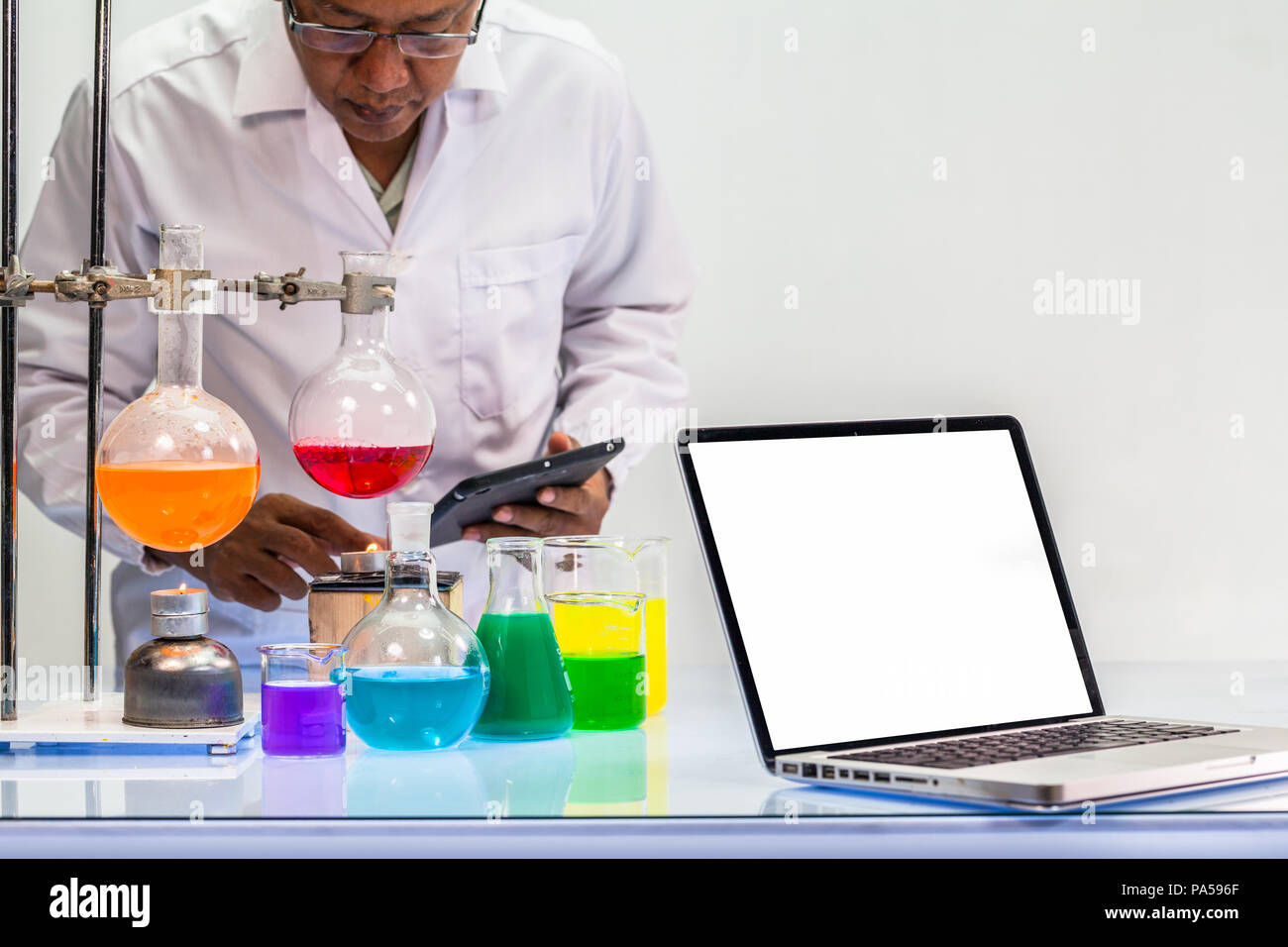a scientist work on computer in chemical mixing in laboratory ...
