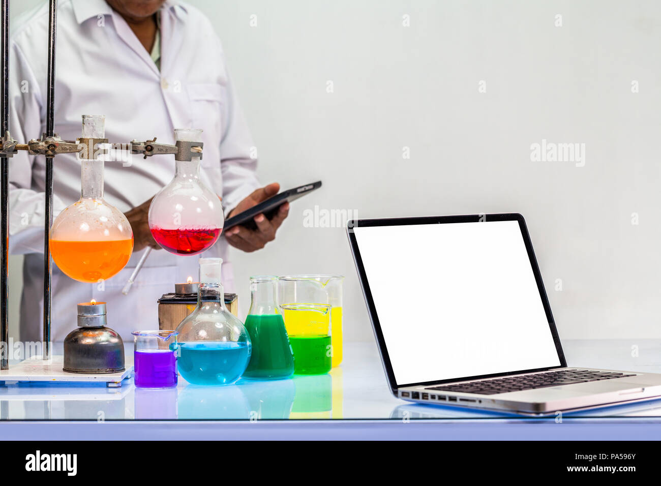a scientist work on computer in chemical mixing in laboratory ...