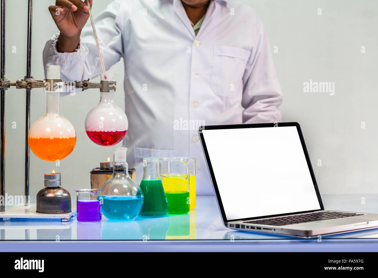 a scientist work on computer in chemical mixing in laboratory ...