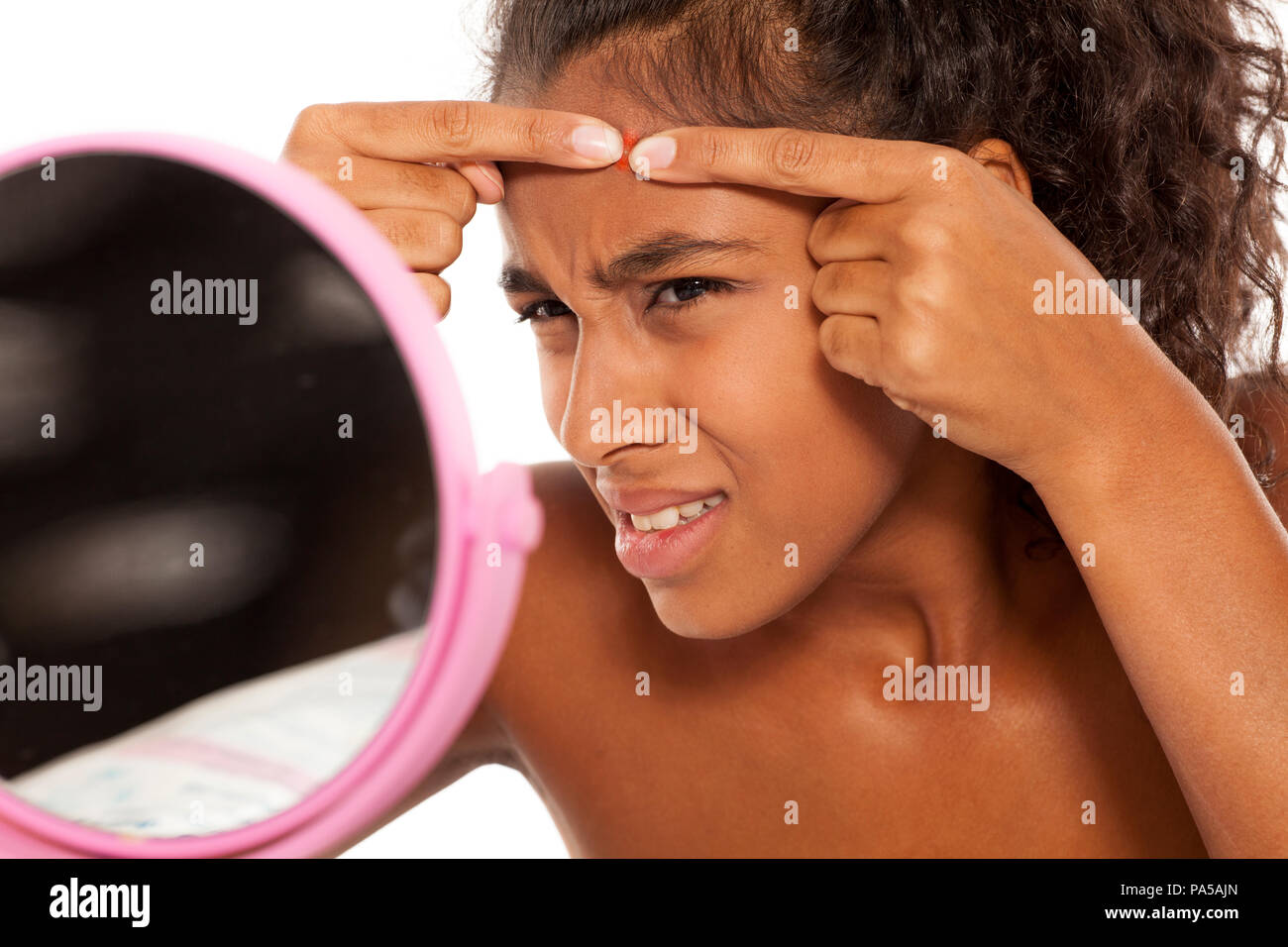 young beautiful black woman squeezing pimples on her face Stock Photo ...