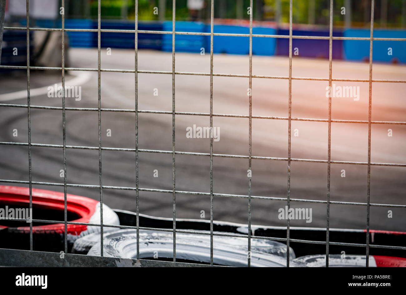 Metal net fence behind tire protection for racing car crash in race ...