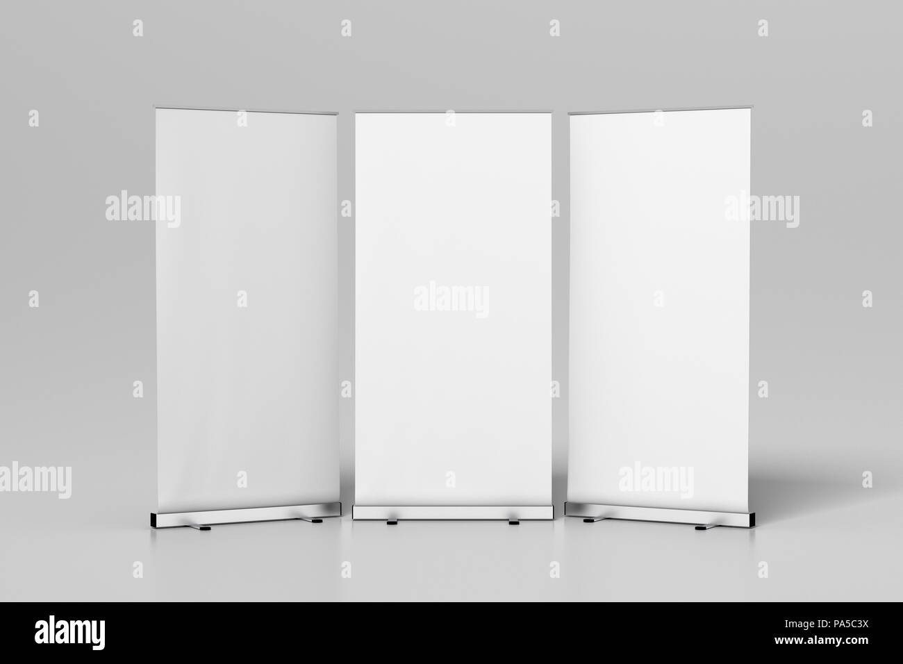 Three blank roll up banner stands isolated on white. Include clipping ...