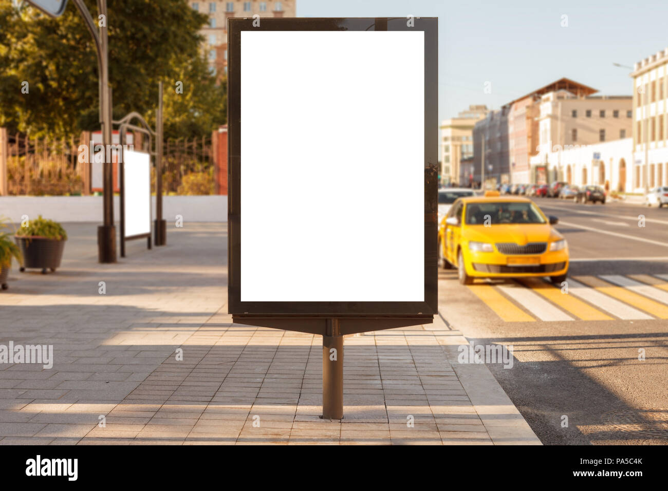 Blank vertical street billboard stand with city background Stock Photo ...