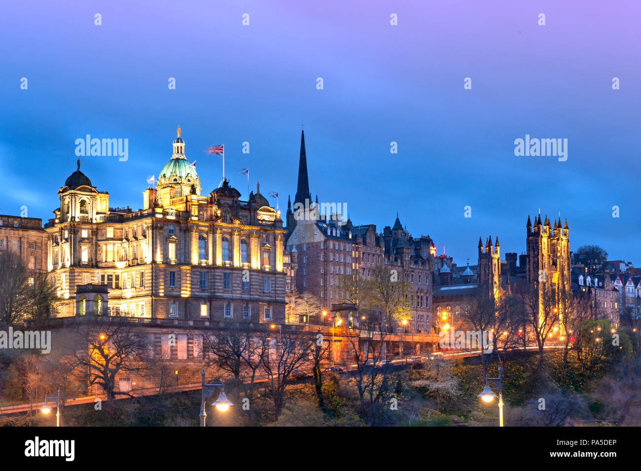 Cityscape in old town district of Edinburgh City being lit up at night ...