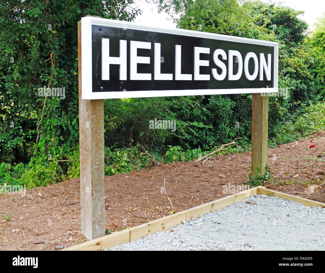 A sign erected by the restored platform on the site of the former M&GN ...
