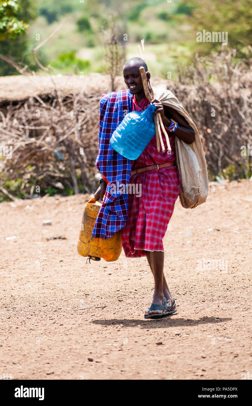 AMBOSELI, KENYA - OCTOBER 10, 2009: Unidentified Massai man walks ...