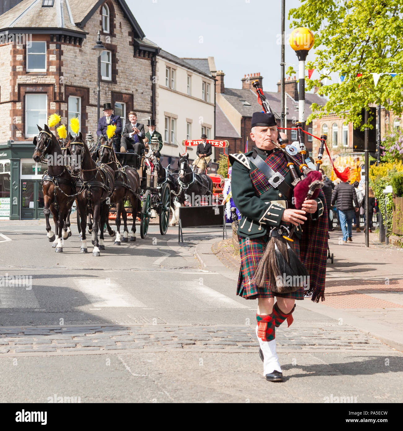 A Scots piper takes part in the annual May Day parade in Penrith town ...