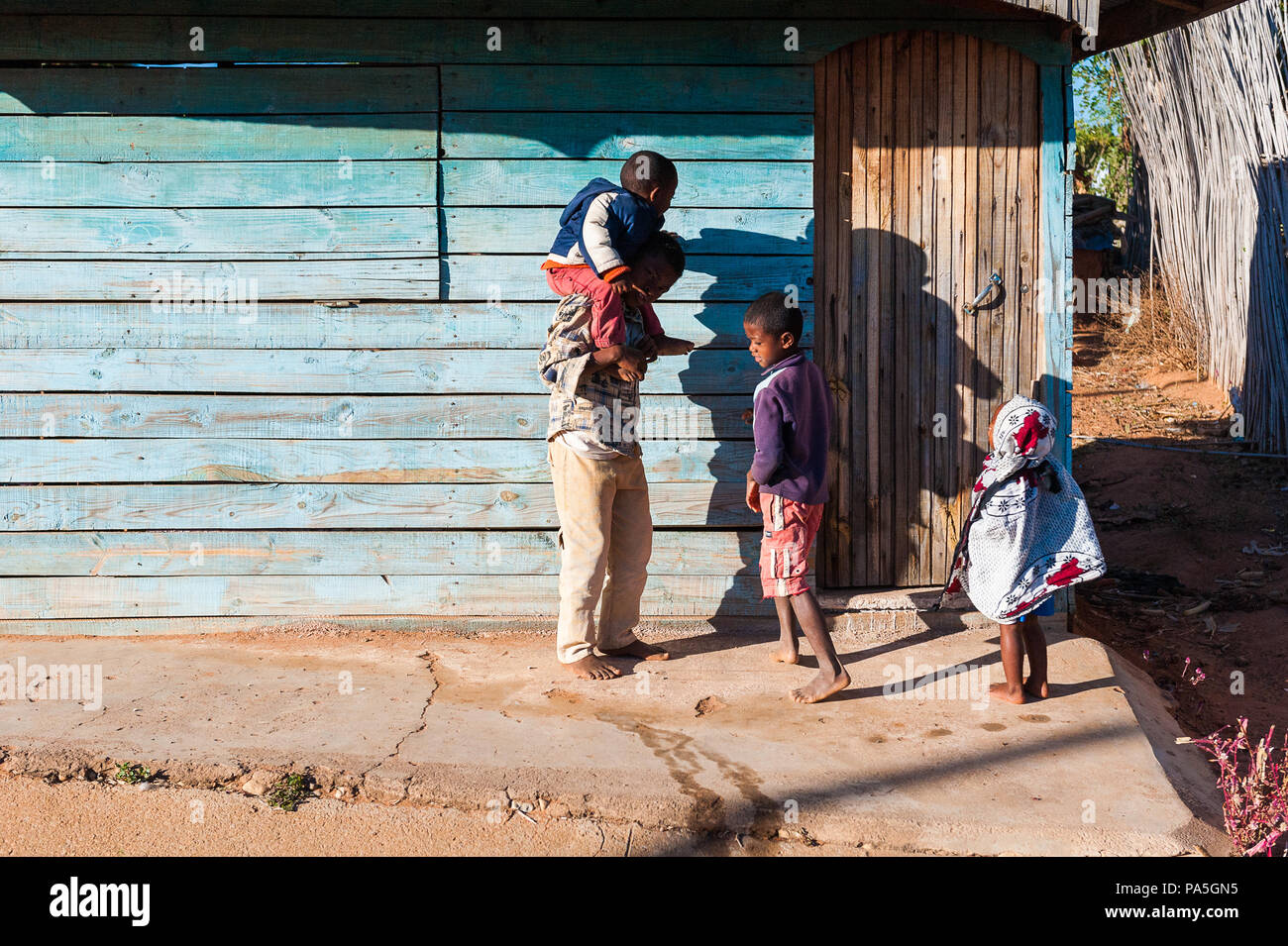 ANTANANARIVO, MADAGASCAR - JULY 3, 2011: Unidentified Madagascar father ...