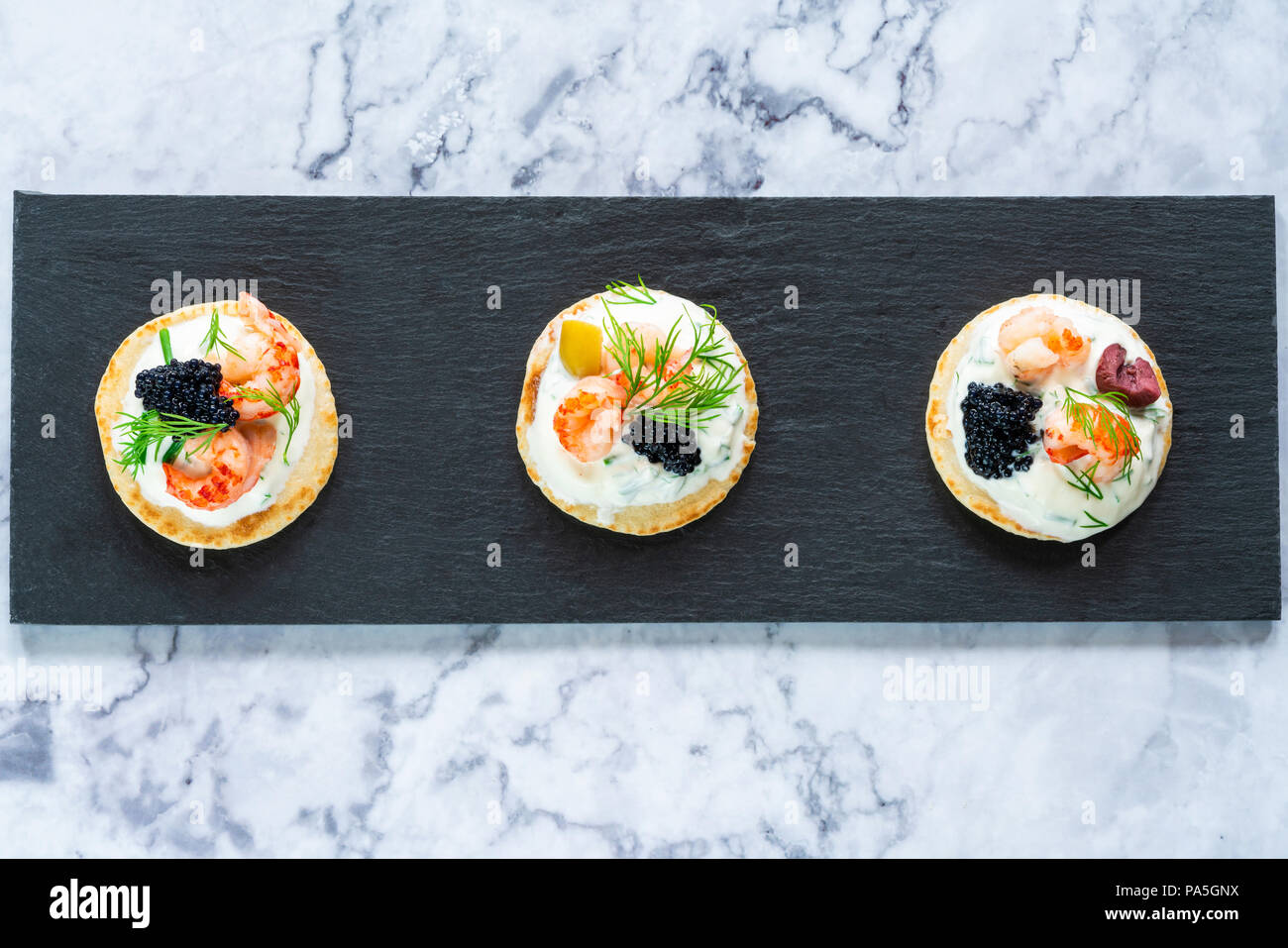 Cocktail blinis with crayfish, caviar and sour cream - gourmet party ...