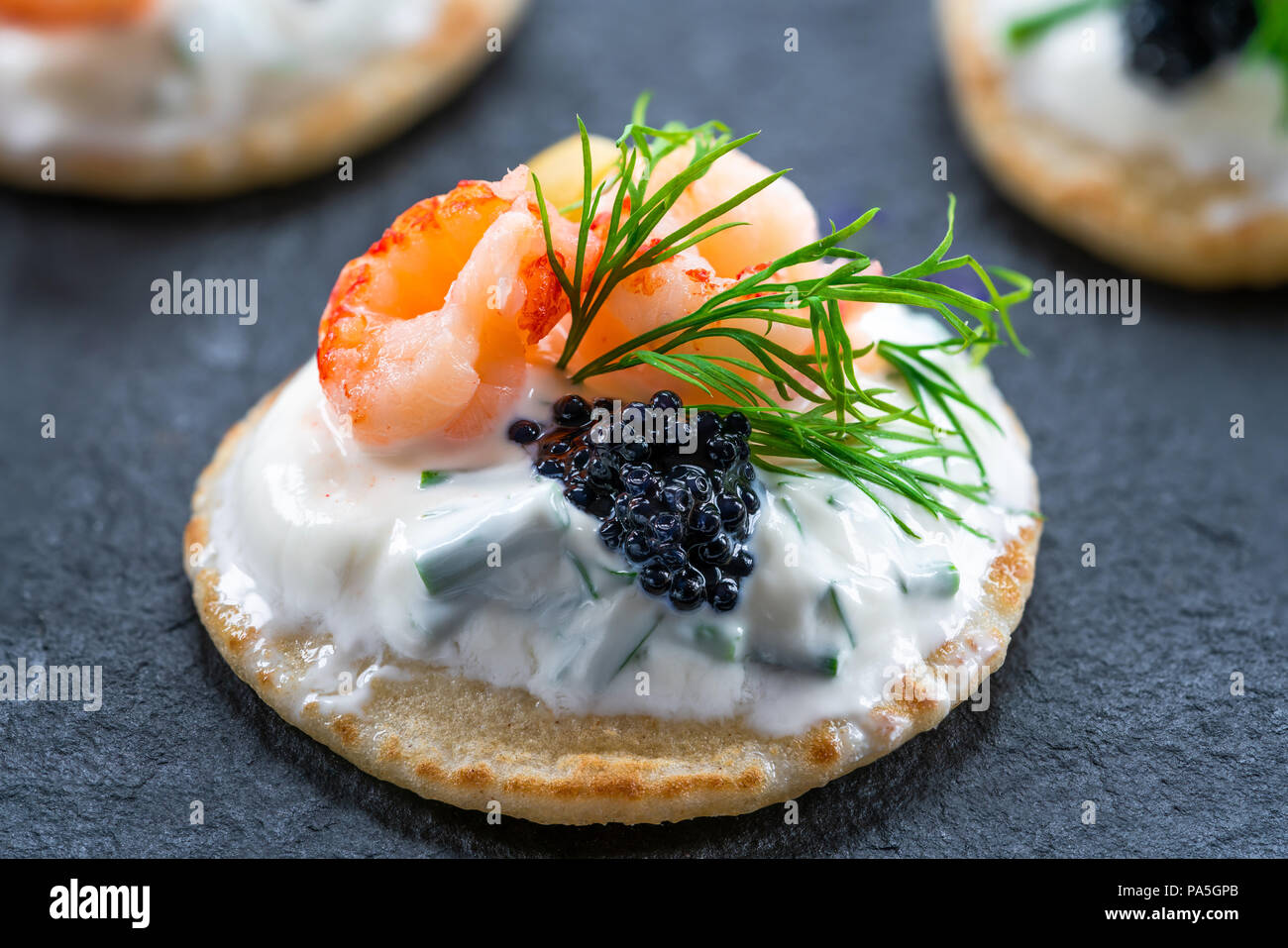Cocktail blinis with crayfish, caviar and sour cream - gourmet party ...