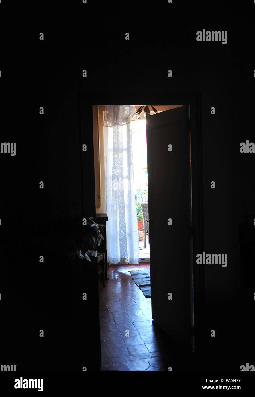 Early morning looking out of an open window and shutters leading to the ...