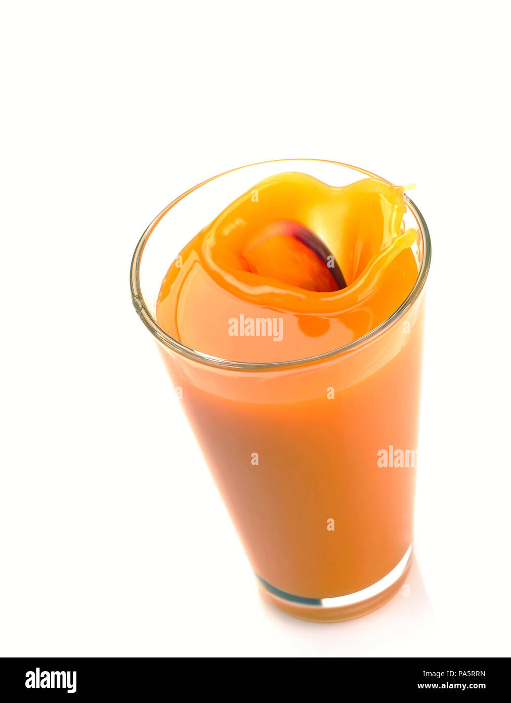 peach juice splash on a white background Stock Photo - Alamy