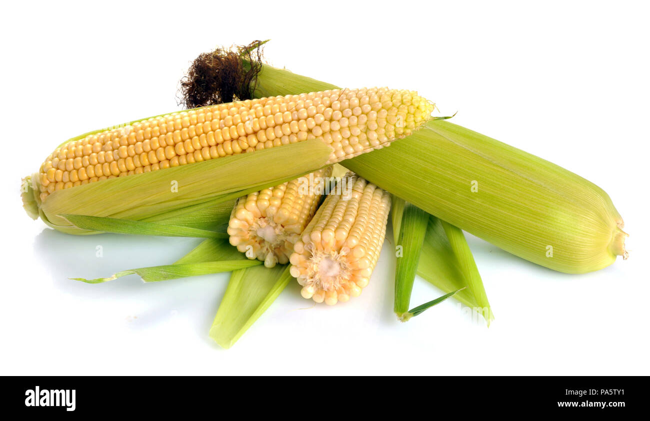 fresh corn fruits with green leaves on white background Stock Photo - Alamy