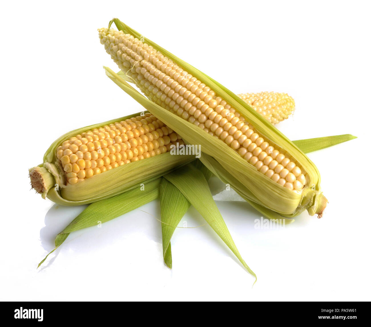 fresh corn fruits with green leaves isolated on white background Stock ...