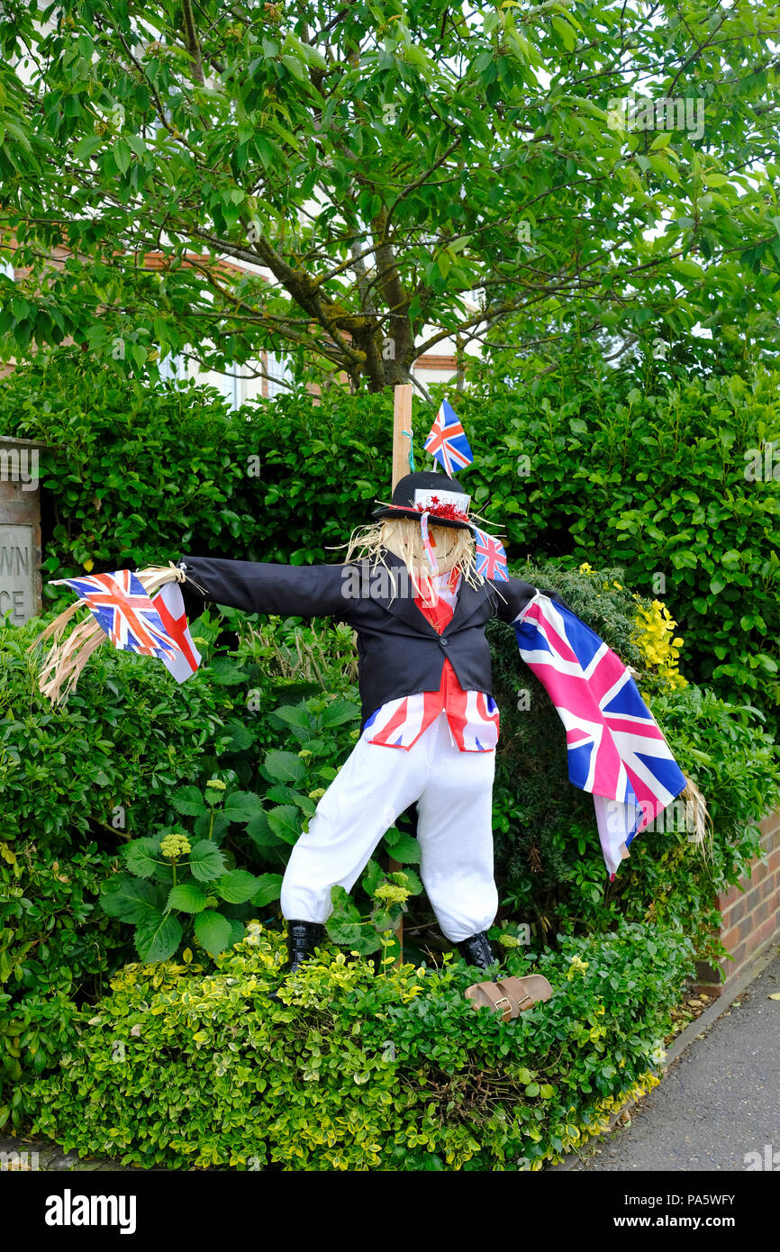 Male scarecrow in garden dressed as John Bull in dark jacket and white ...