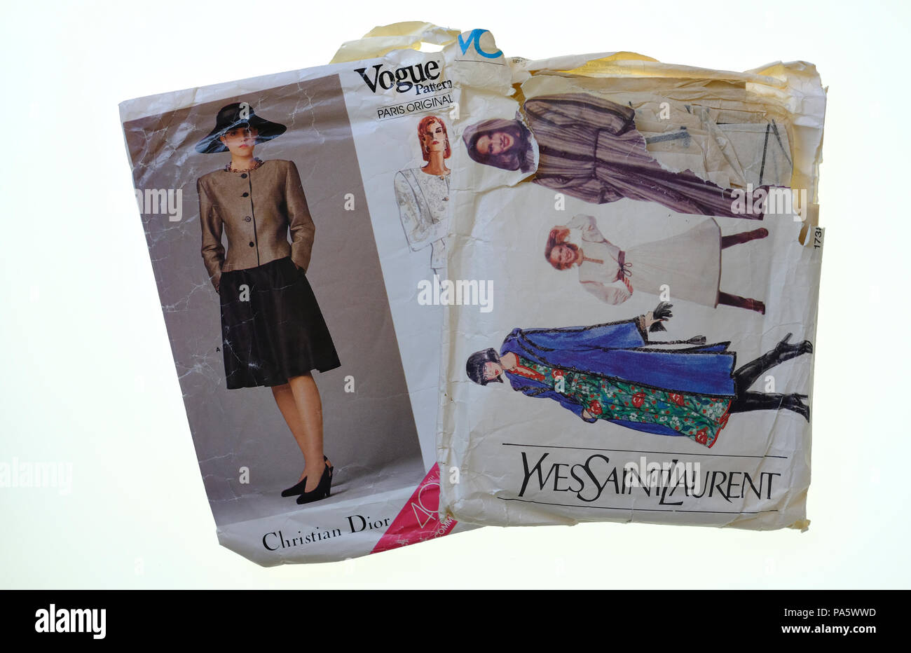 Vintage Christian Dior and Yves Saint Laurent sewing patterns on white ...