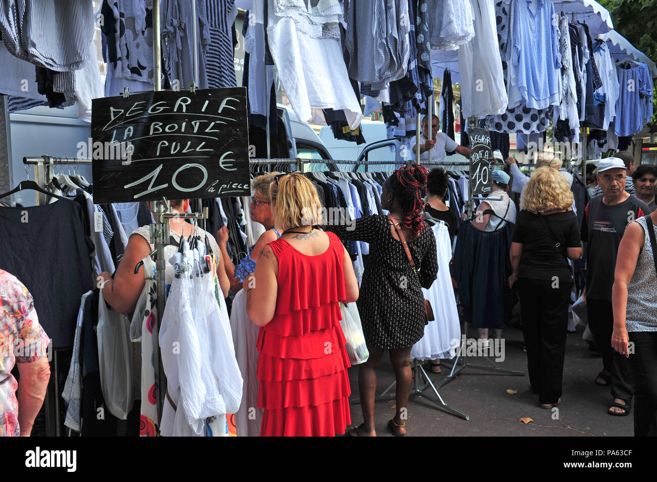 People shopping at the busy Friday clothes french market held each week ...