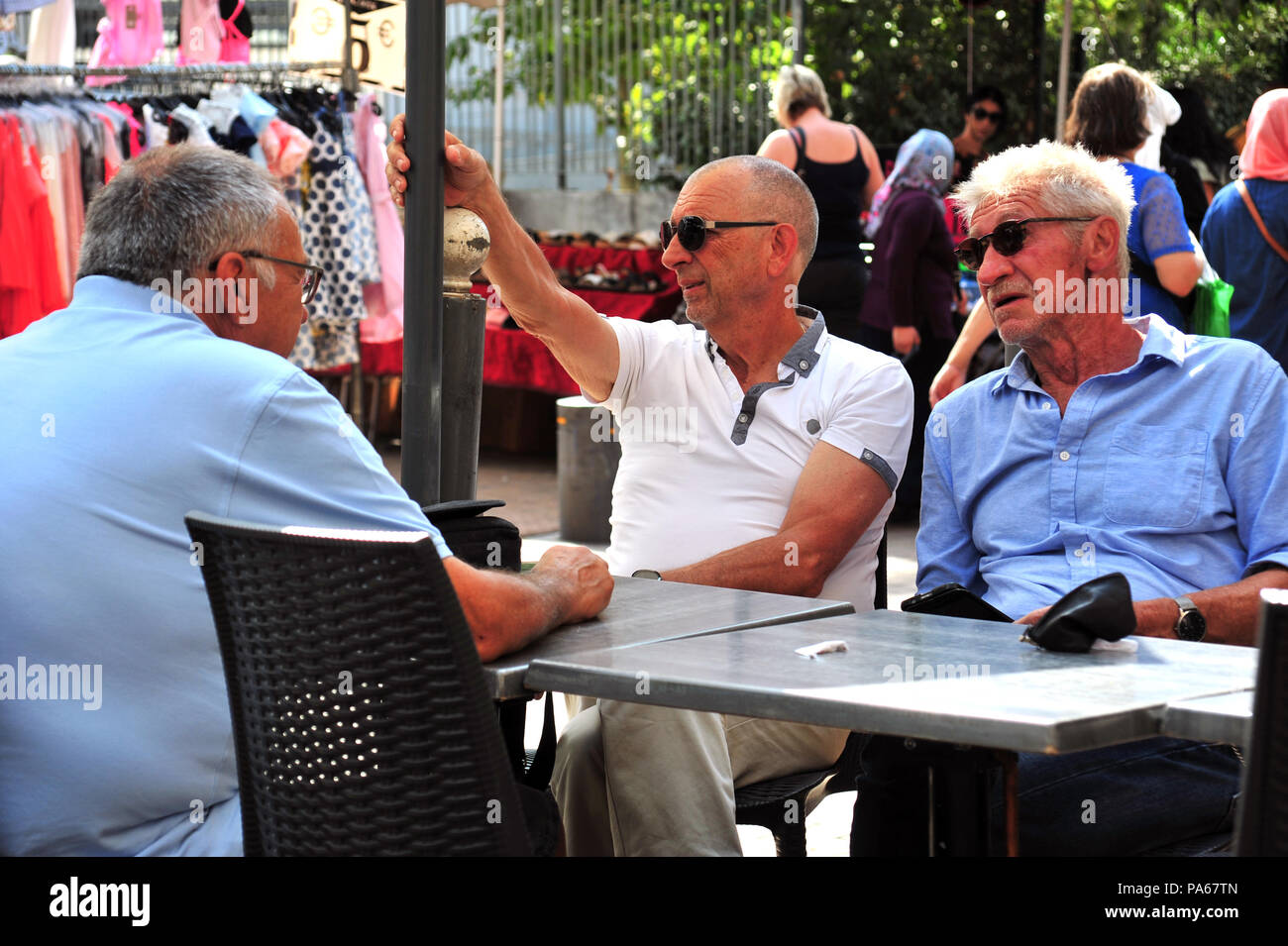 Three guys chatting communicating sitting hi-res stock photography and ...