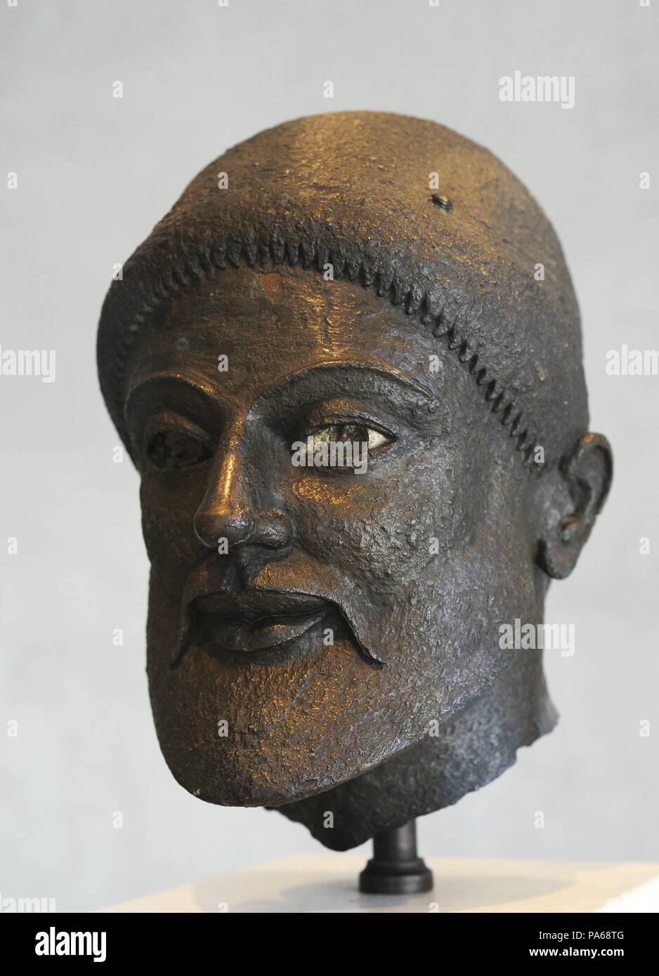 Head of a bronze statue. Bearded Hoplite who would have worn a helmet ...