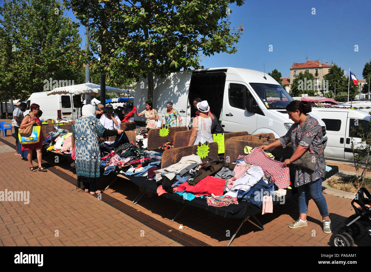 Stall holders working behind their market stall at a busy Friday ...