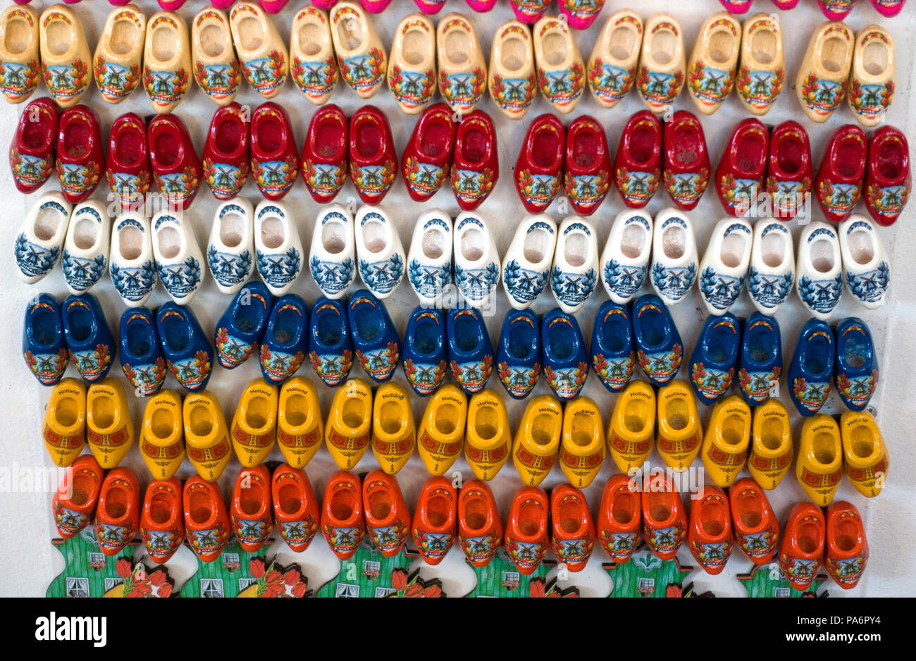 Small Dutch wooden shoes in the colors of the Dutch National flag. In a ...