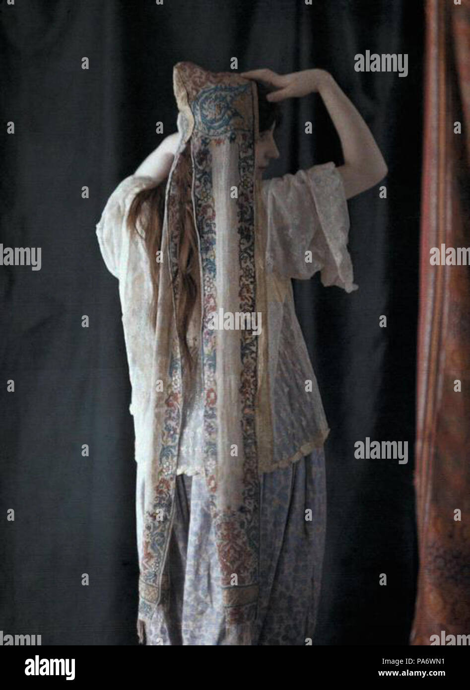 18 An Algerian woman models a headdress worn only on festive occasions ...