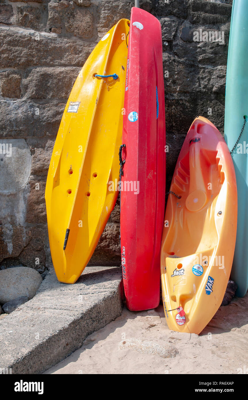 Canoes, kayak etc. in Mousehole, Cornwall UK Stock Photo - Alamy