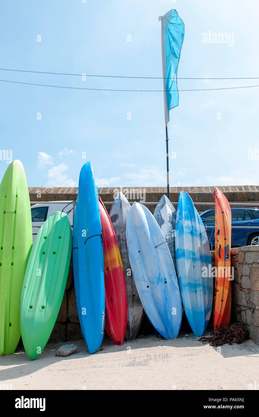Canoes, kayak etc. in Mousehole, Cornwall UK Stock Photo - Alamy