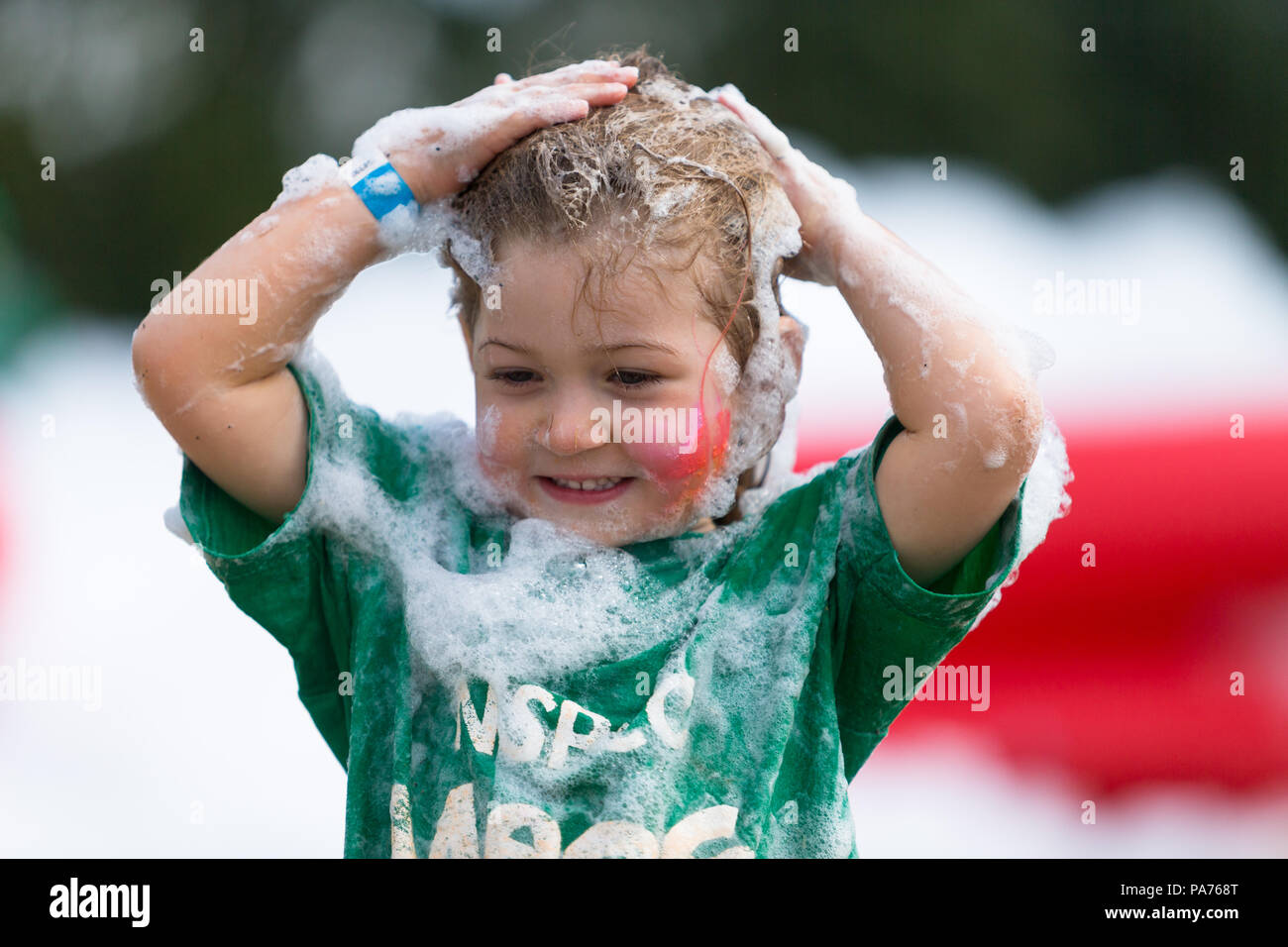 A young girl has messy fun at the NSPCC Messathon in Sandwell Valley ...