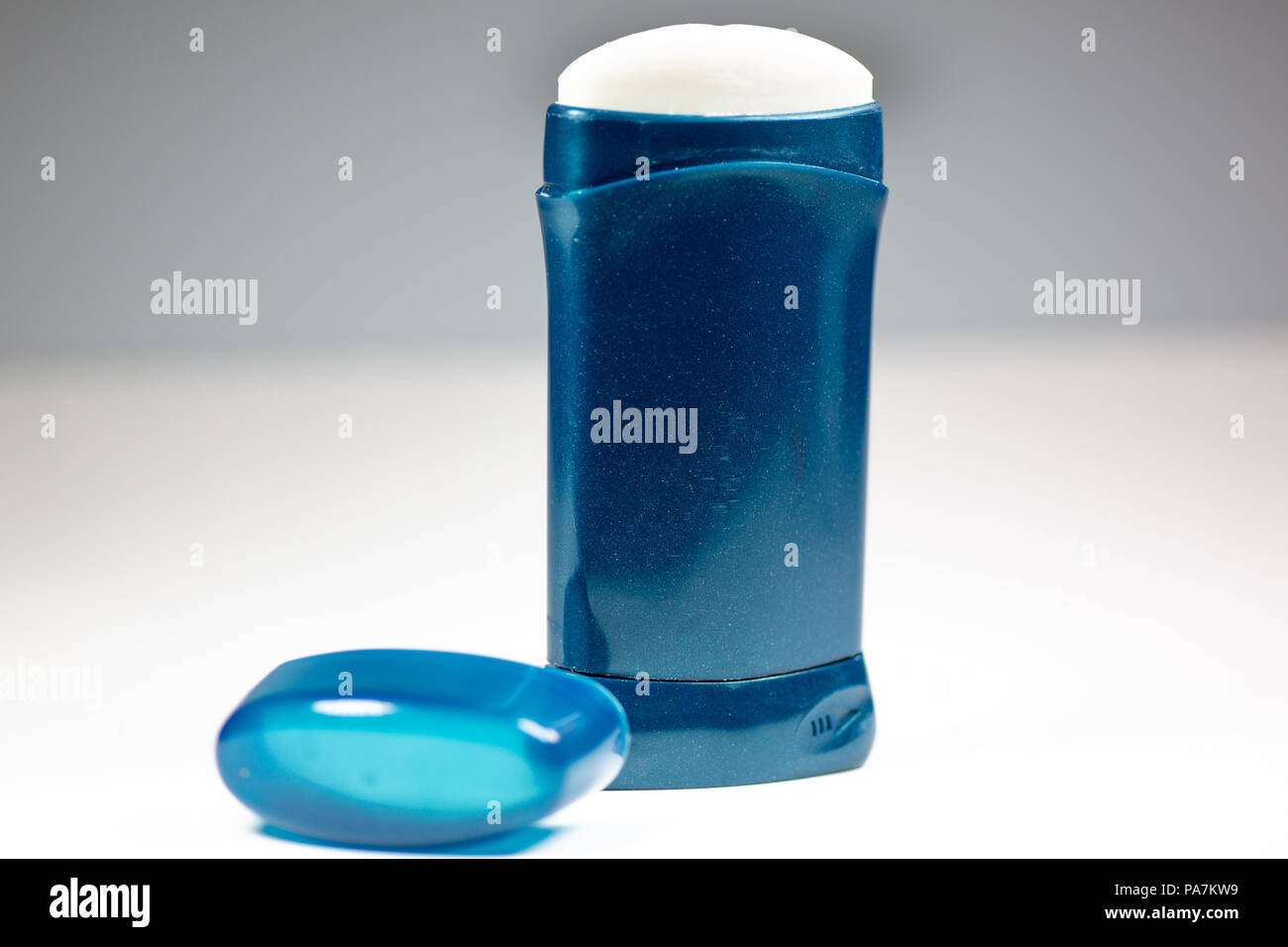 A blue deodorant stick on a white surface Stock Photo - Alamy