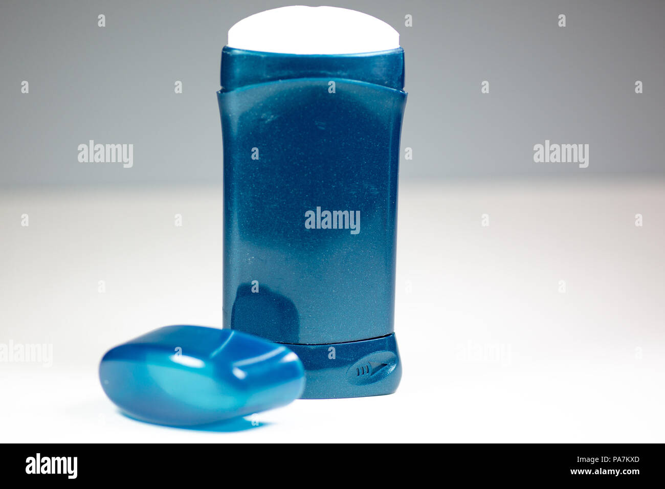 A blue deodorant stick on a white surface Stock Photo - Alamy