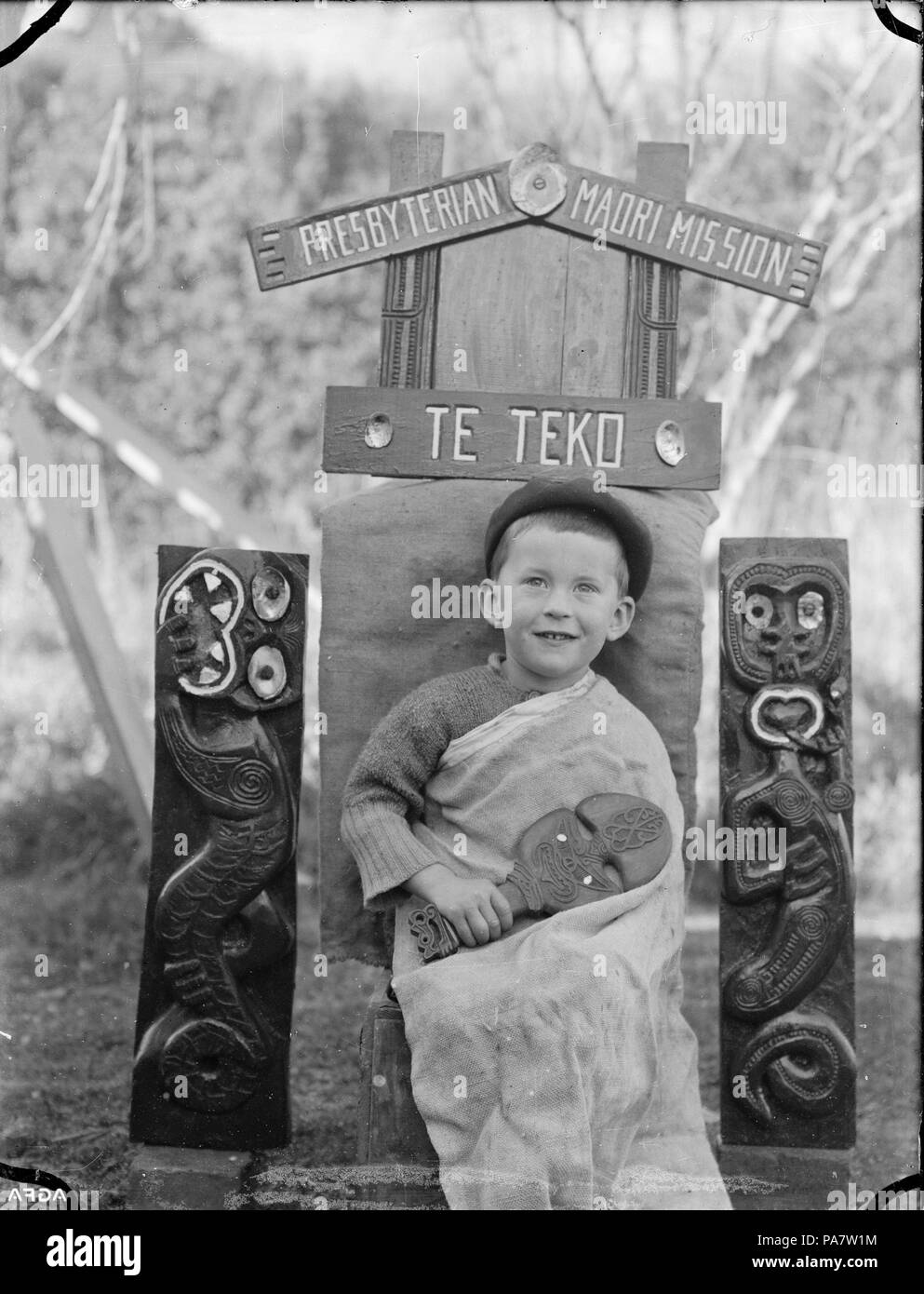 15 Albert Percy Godber's grandson Colin, seated beneath a carved sign ...