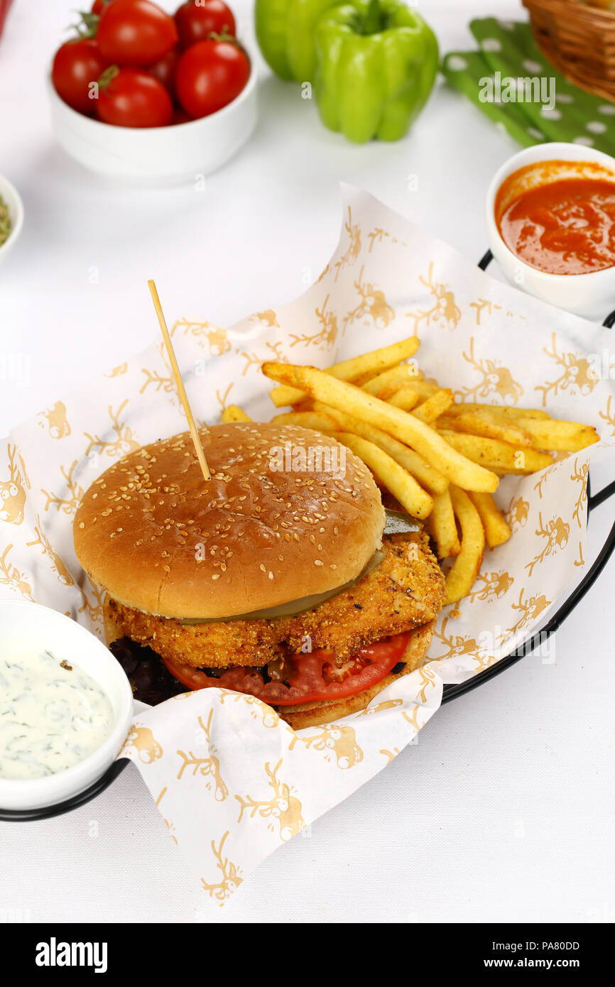 Chicken Burger with french fries and sauce Stock Photo - Alamy