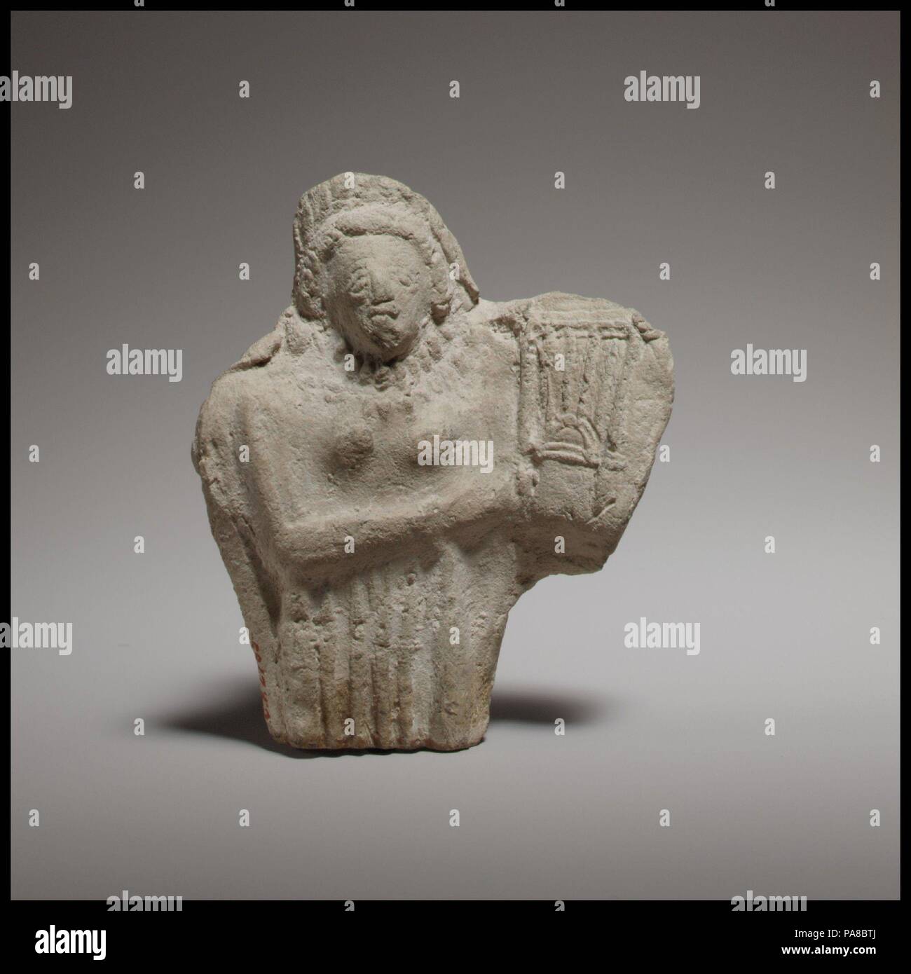 Standing female kithara player. Culture: Cypriot. Dimensions: H. 3 1/8 ...