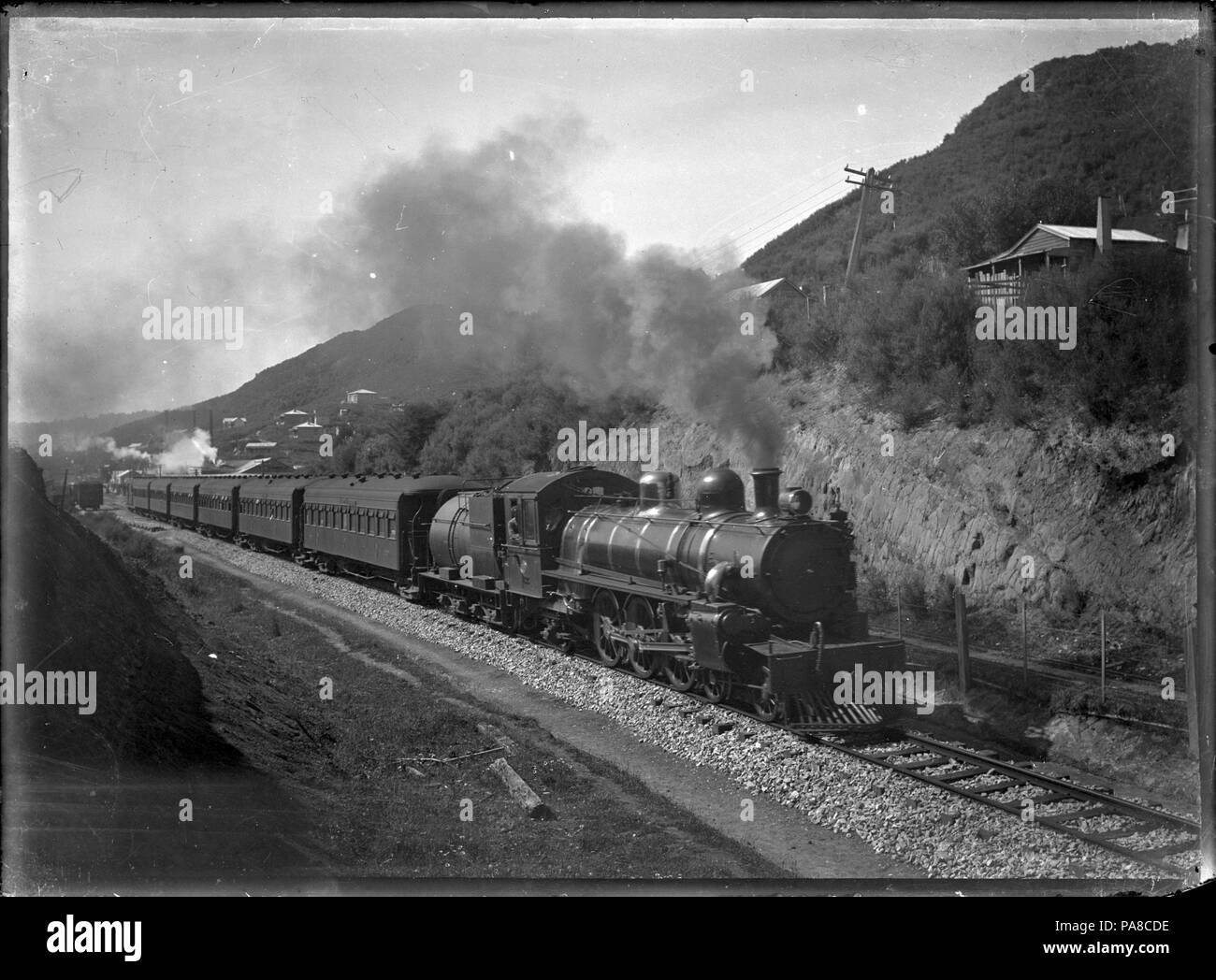 52 Class Ab steam locomotive with passenger train passing Mangapehi ...