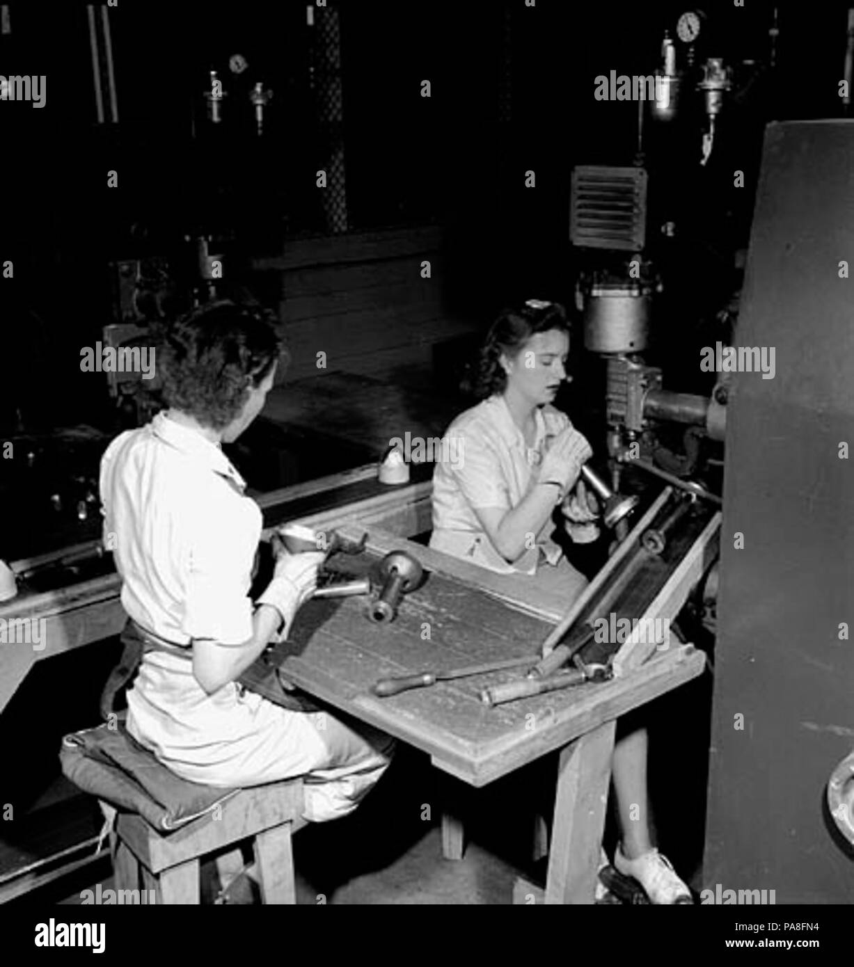 81 Female workers assembling Piat anti-tank gun parts. Orilla, Ontario ...