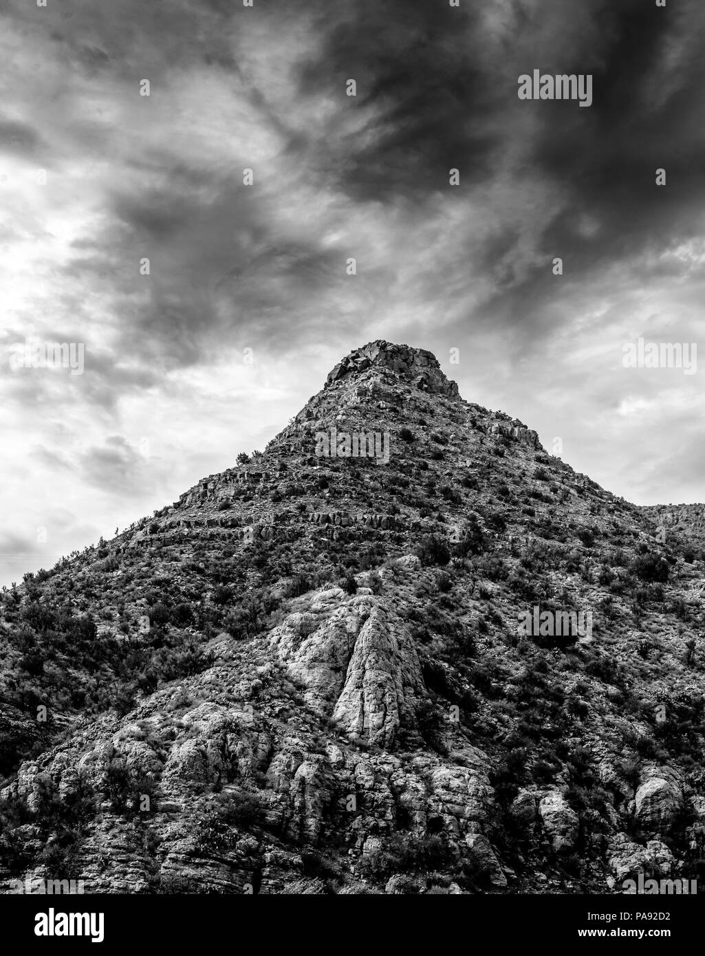 A large intimidating rocky mountain in black and white. Symbolism for ...