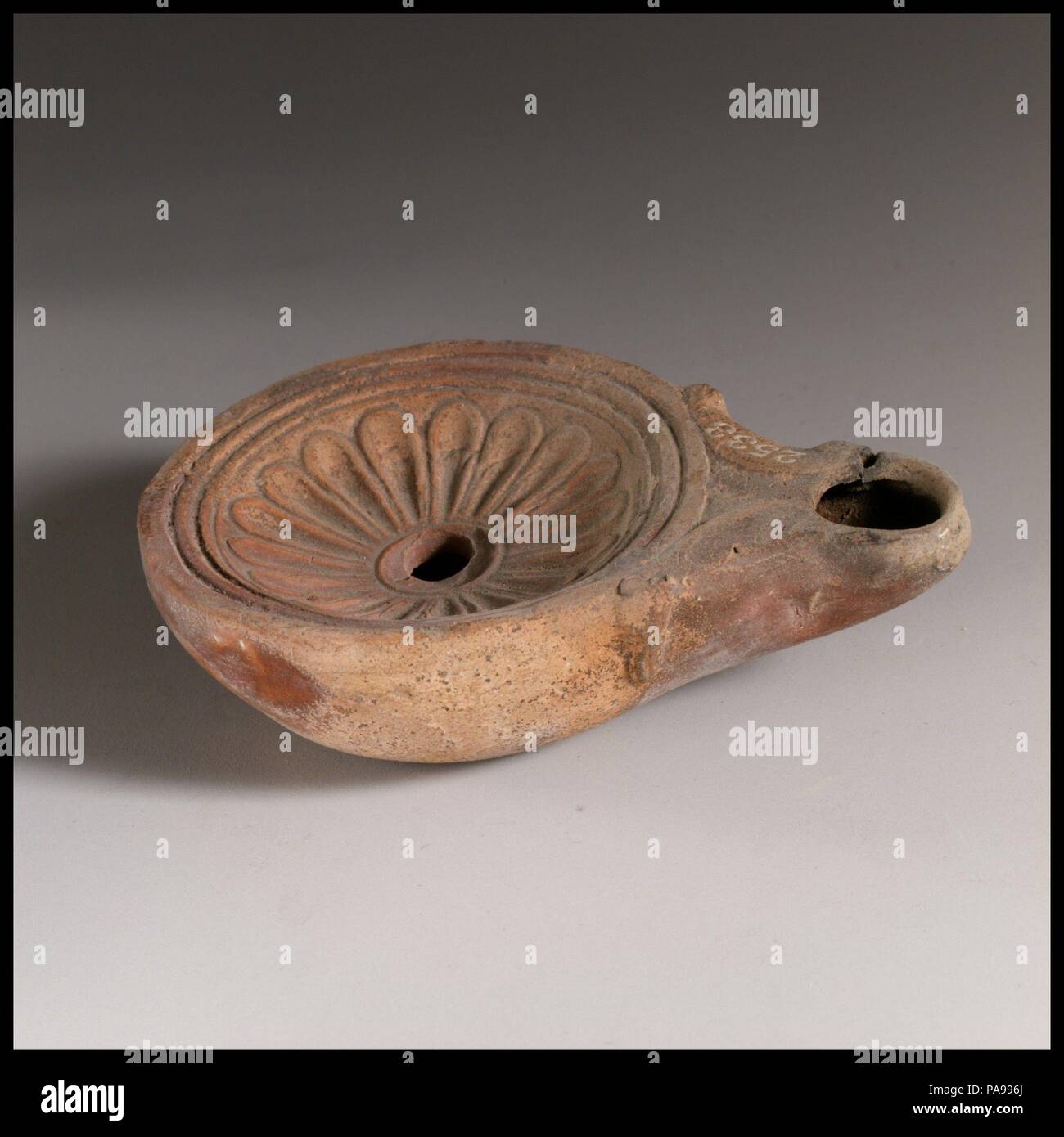 Lamp. Culture: Roman. Dimensions: Length: 3 3/16 in. (8.1 cm) Height ...
