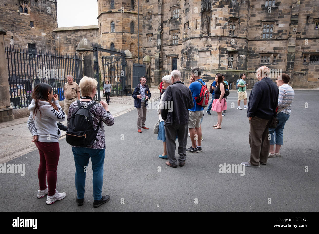 Visitors and tourists with the guided tour guide assemble in the ...