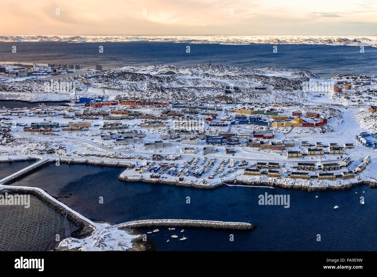 Aerial sunset view of streets with colorful inuit houses and living ...