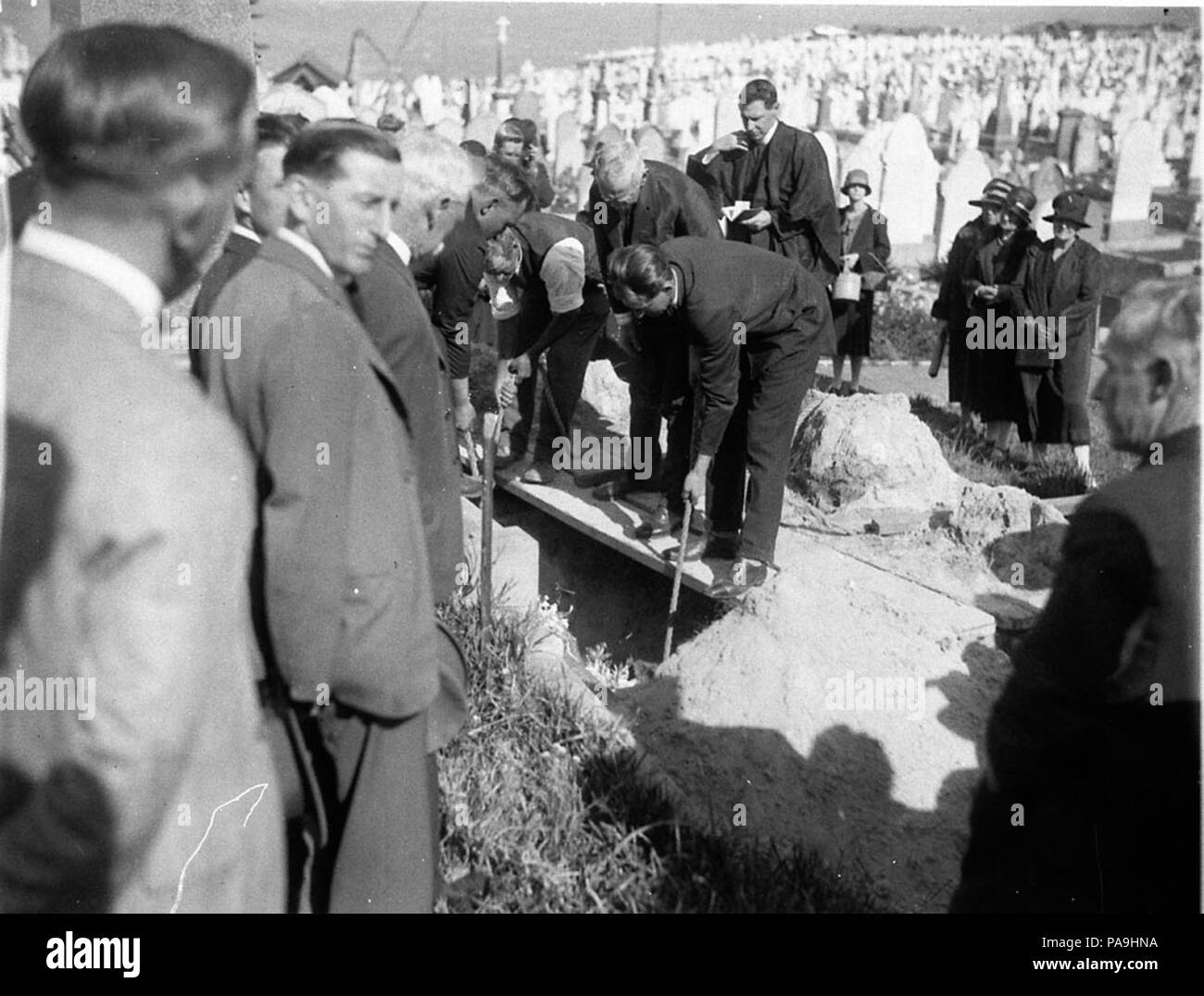 Lowering coffin hi-res stock photography and images - Alamy
