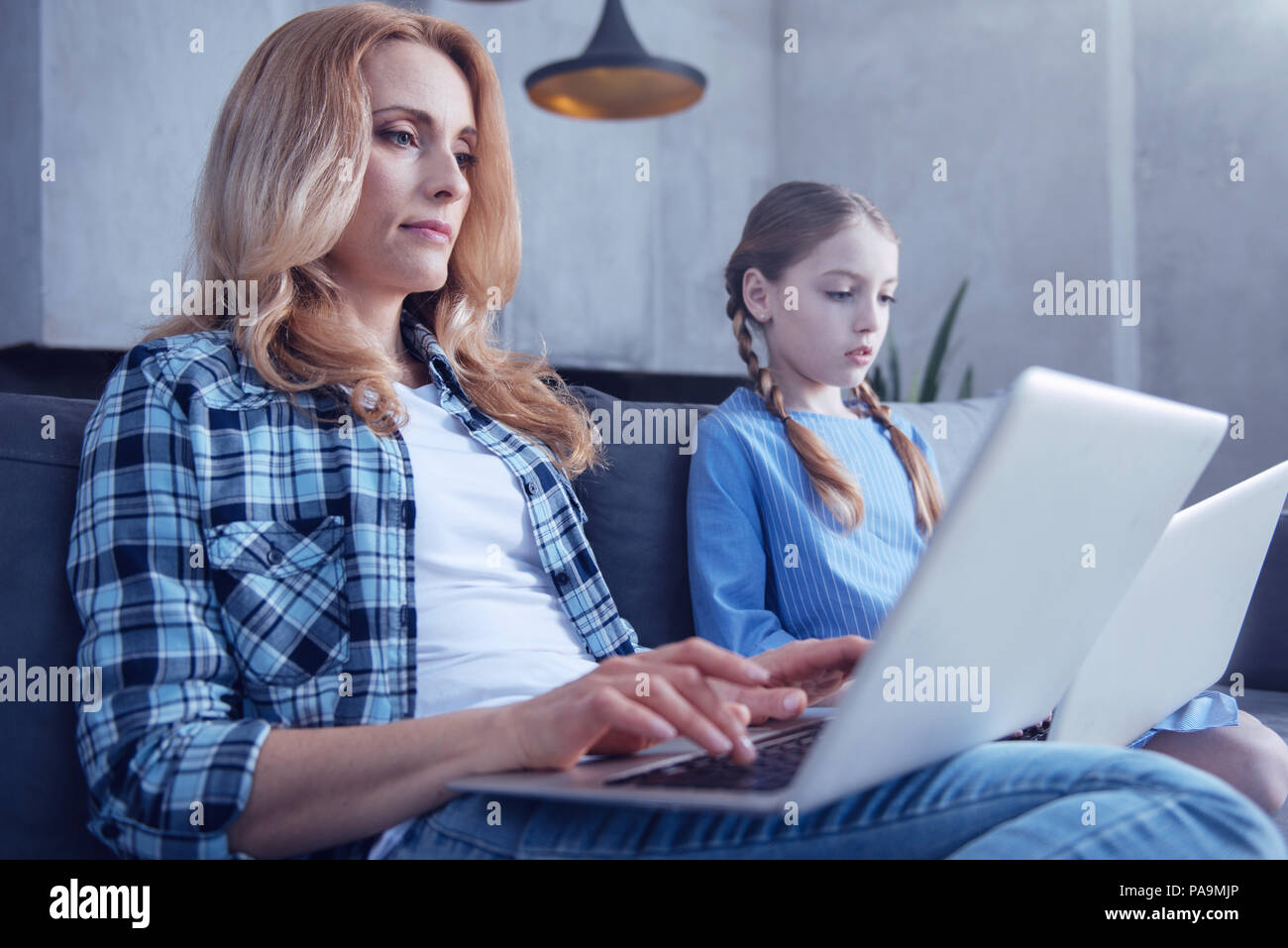 Beautiful smart woman using a laptop Stock Photo - Alamy