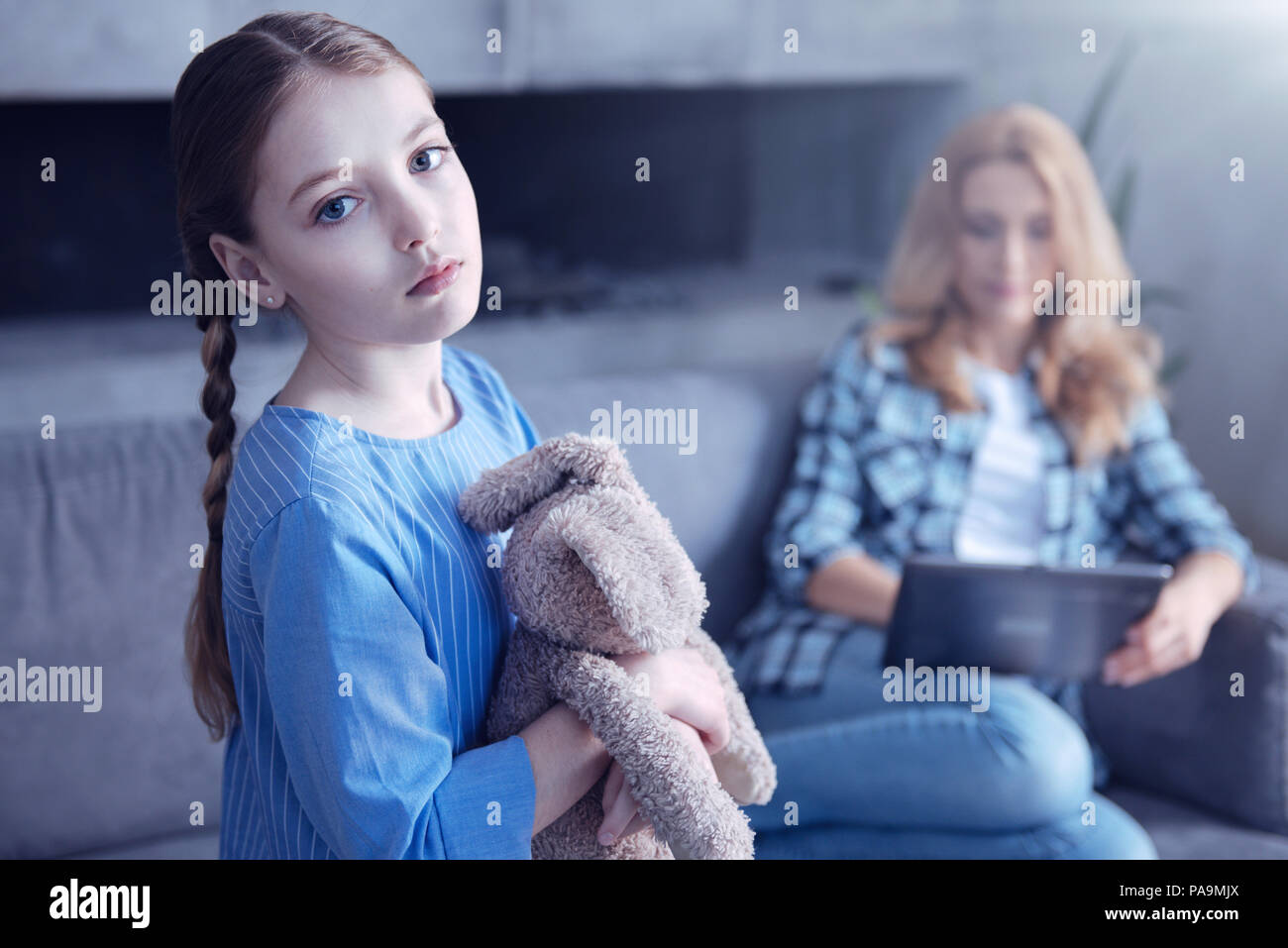Cheerless cute girl receiving no attention Stock Photo - Alamy
