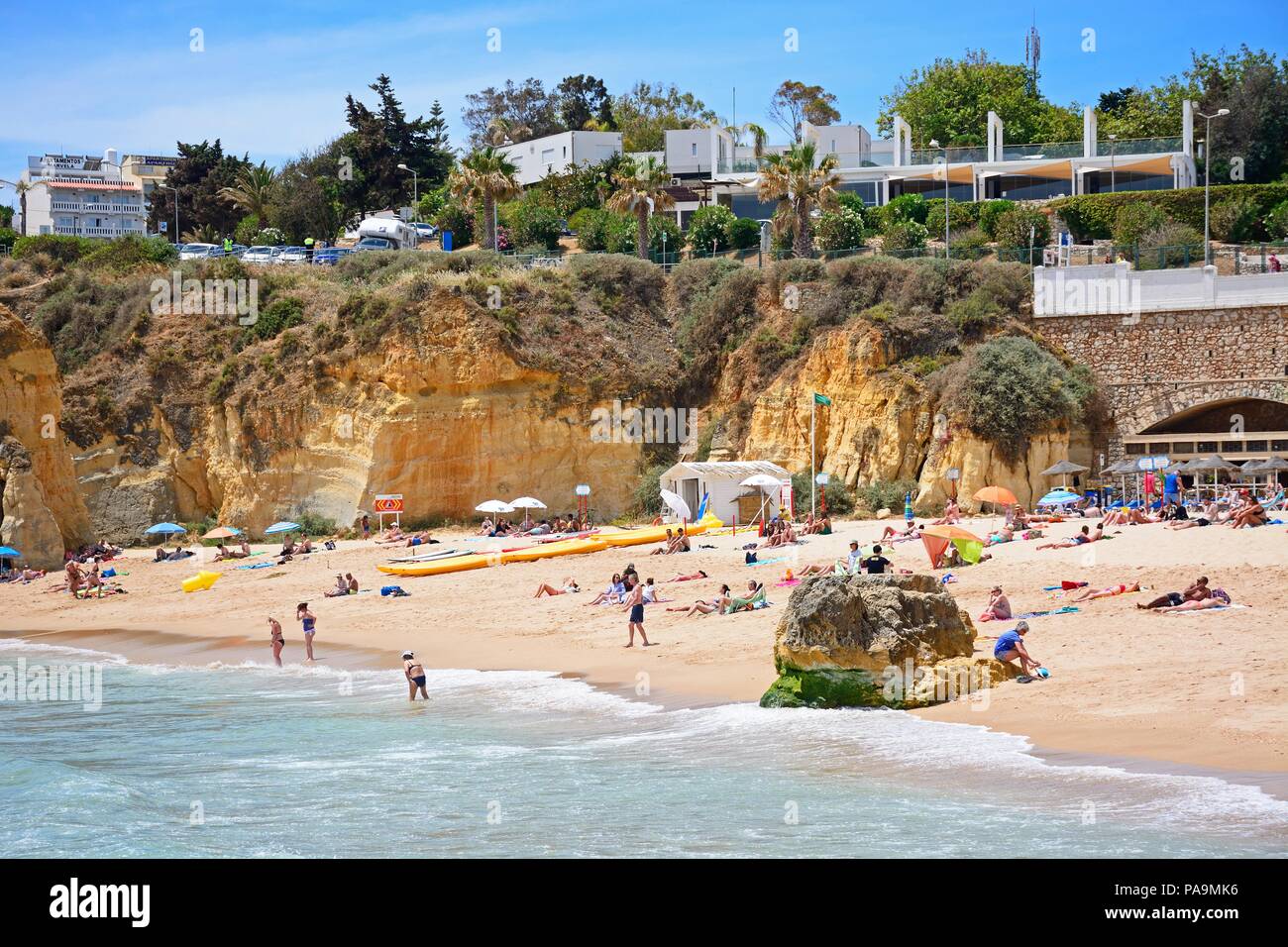 Tourists relaxing on Praia da Batata beach, Lagos, Algarve, Portugal ...