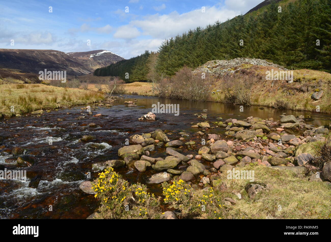 View up Glen Loth in the Scottish Highlands. The mound of stones to the ...