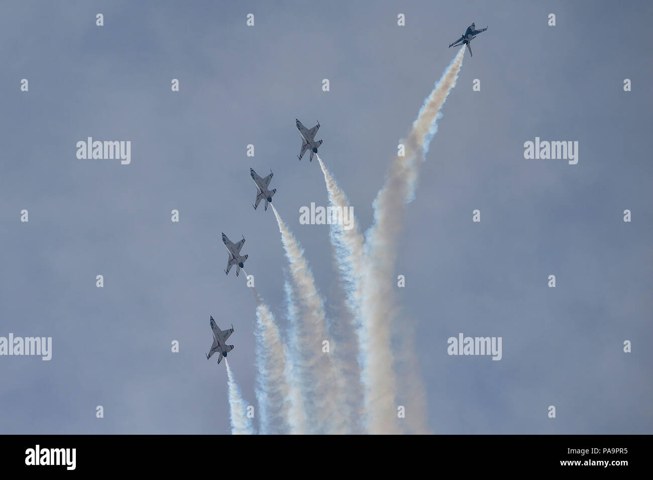 The Thunderbirds pilots perform the Line Break Loop maneuver during the ...