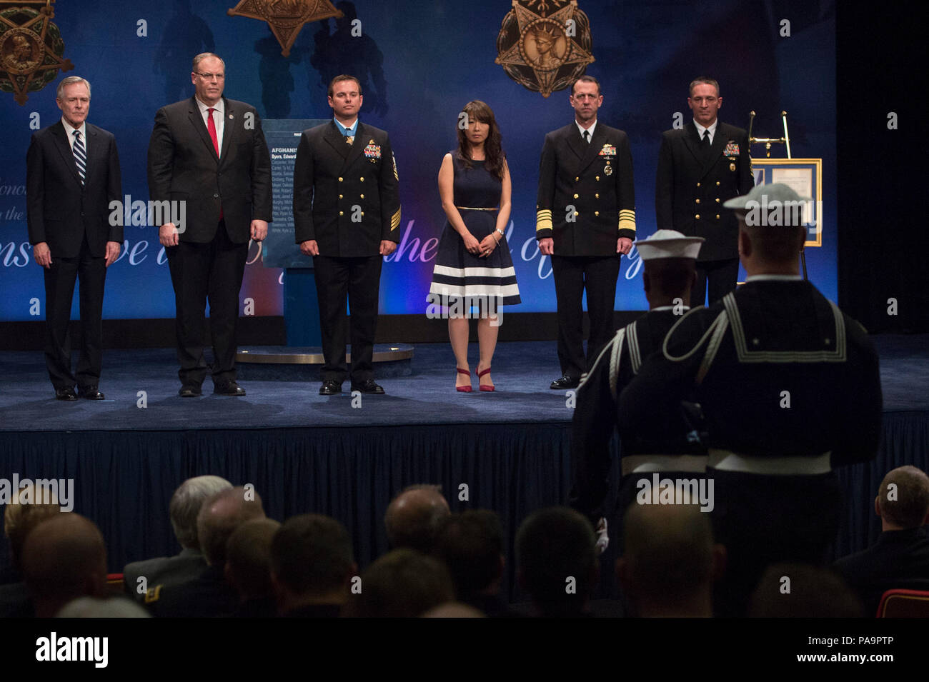 Navy Senior Chief Edward Byers is presented the Medal of Honor flag ...