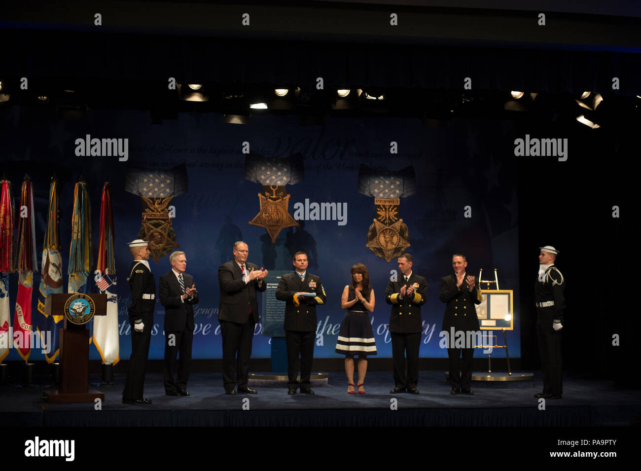 Navy Senior Chief Edward Byers is presented the Medal of Honor flag ...