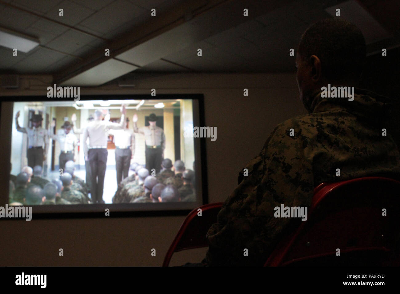 Michael Burnside watches a video of the training phases a recruit will ...