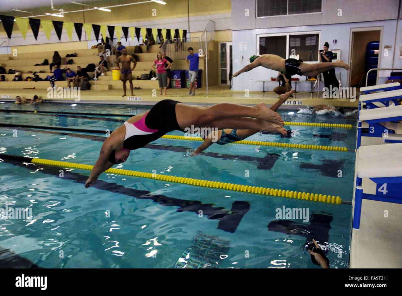 U.S. Army active duty and veterans dive off the starting block into the ...